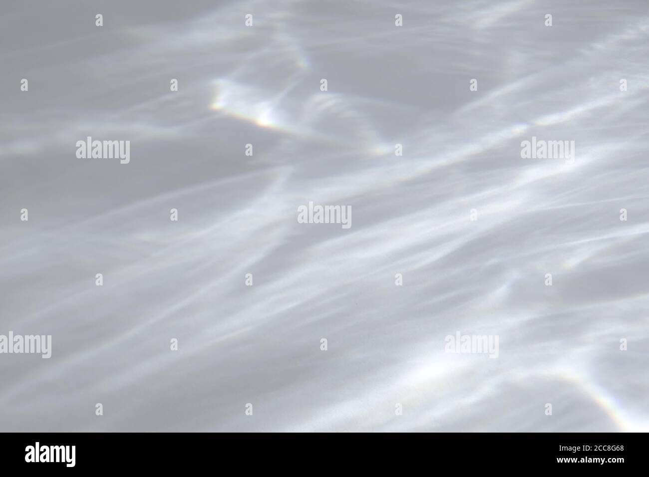 shadow and light caustic effect on a white wall Stock Photo - Alamy