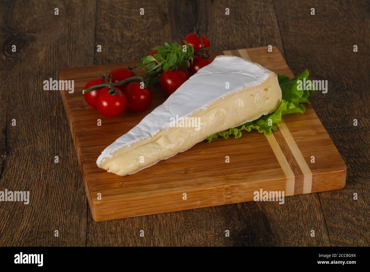Brie cheese triangle served salad leaves Stock Photo - Alamy
