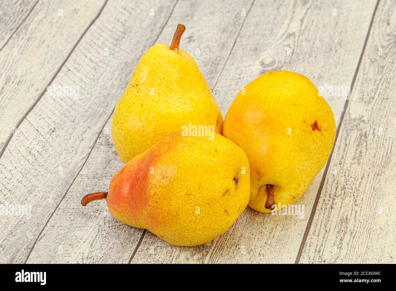 Fresh sweet yellow pear over background Stock Photo - Alamy