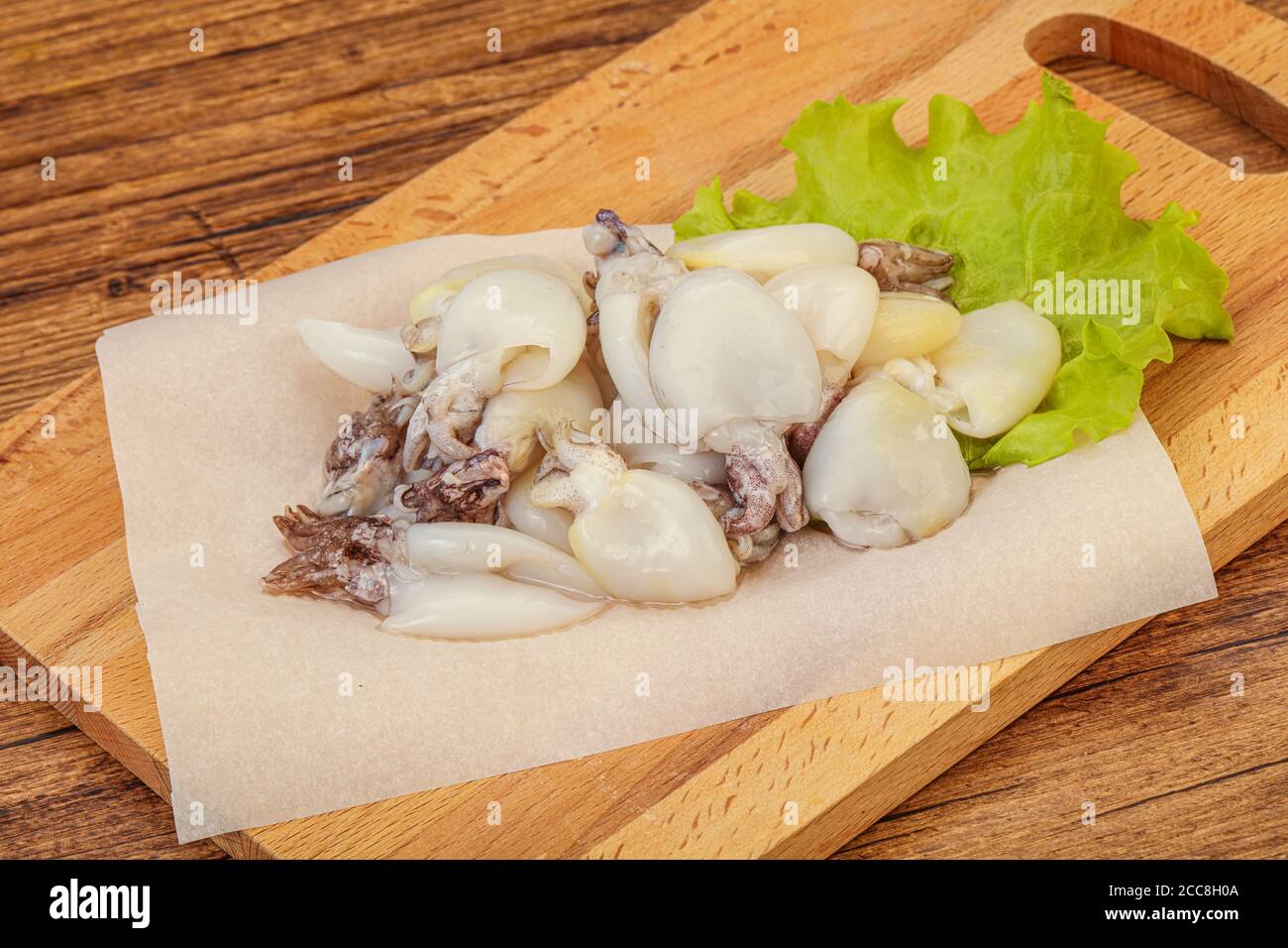 Raw seafood - cuttlefish for cooking over board Stock Photo - Alamy