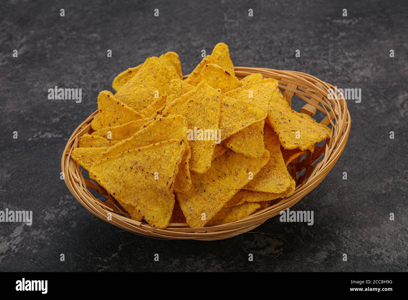 Mexican crunchy corn nachos triangle heap Stock Photo - Alamy