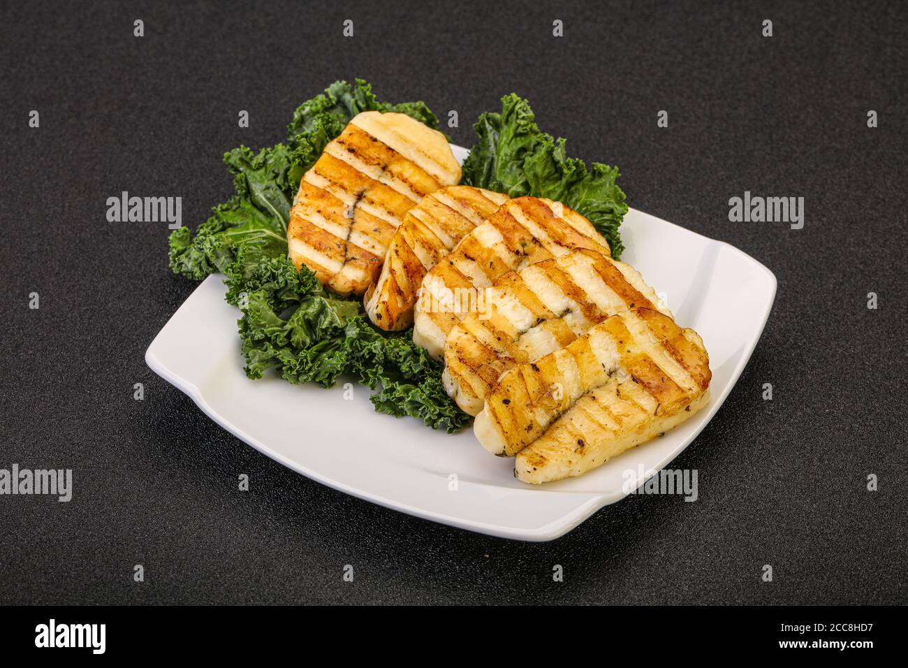 Grilled Greek haloumi cheese with herbs and spices Stock Photo - Alamy