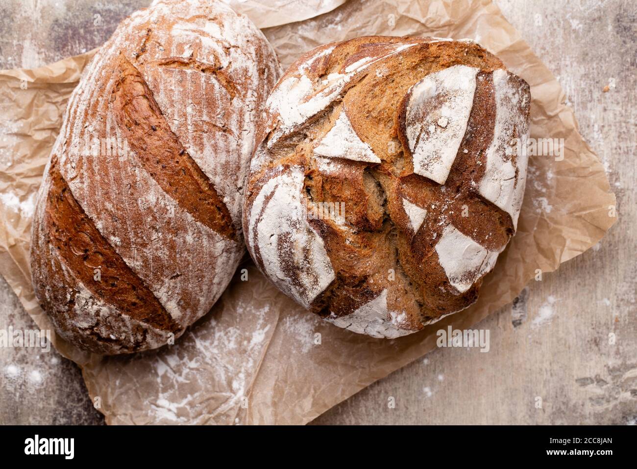 Bread background, top view of, black and rye loaves on black Stock ...