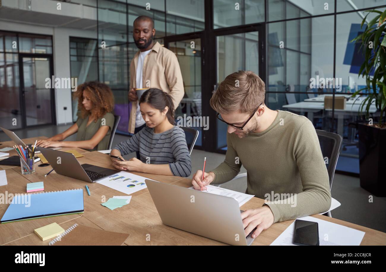 Multiethnic group using laptops hi-res stock photography and images - Alamy