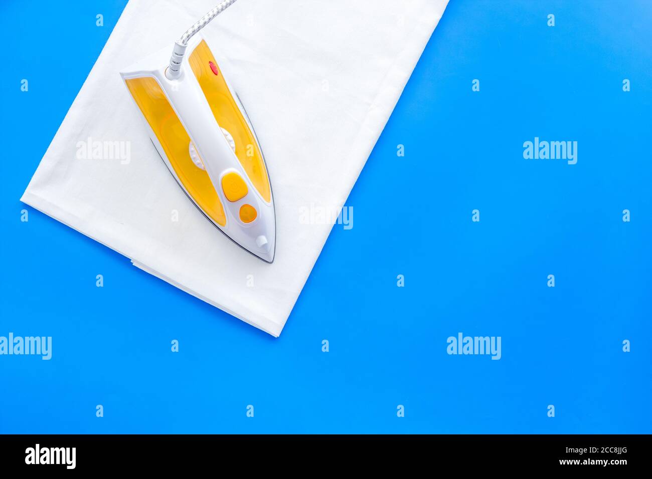 Household laundry ironing concept. Iron with clothes top view Stock ...