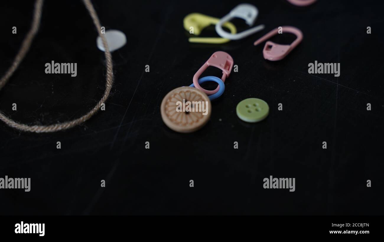 Colourful safety pins and buttons Stock Photo - Alamy