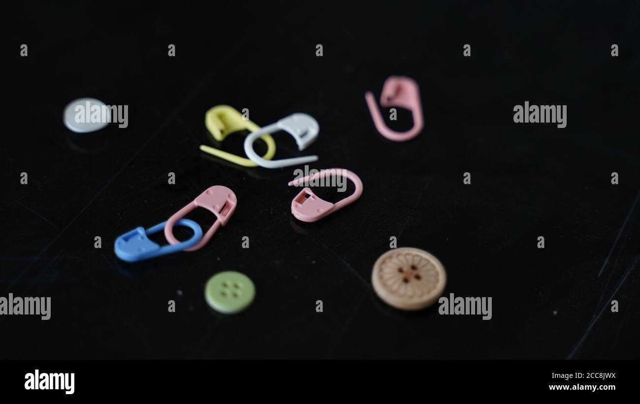 Colourful safety pins and buttons Stock Photo - Alamy