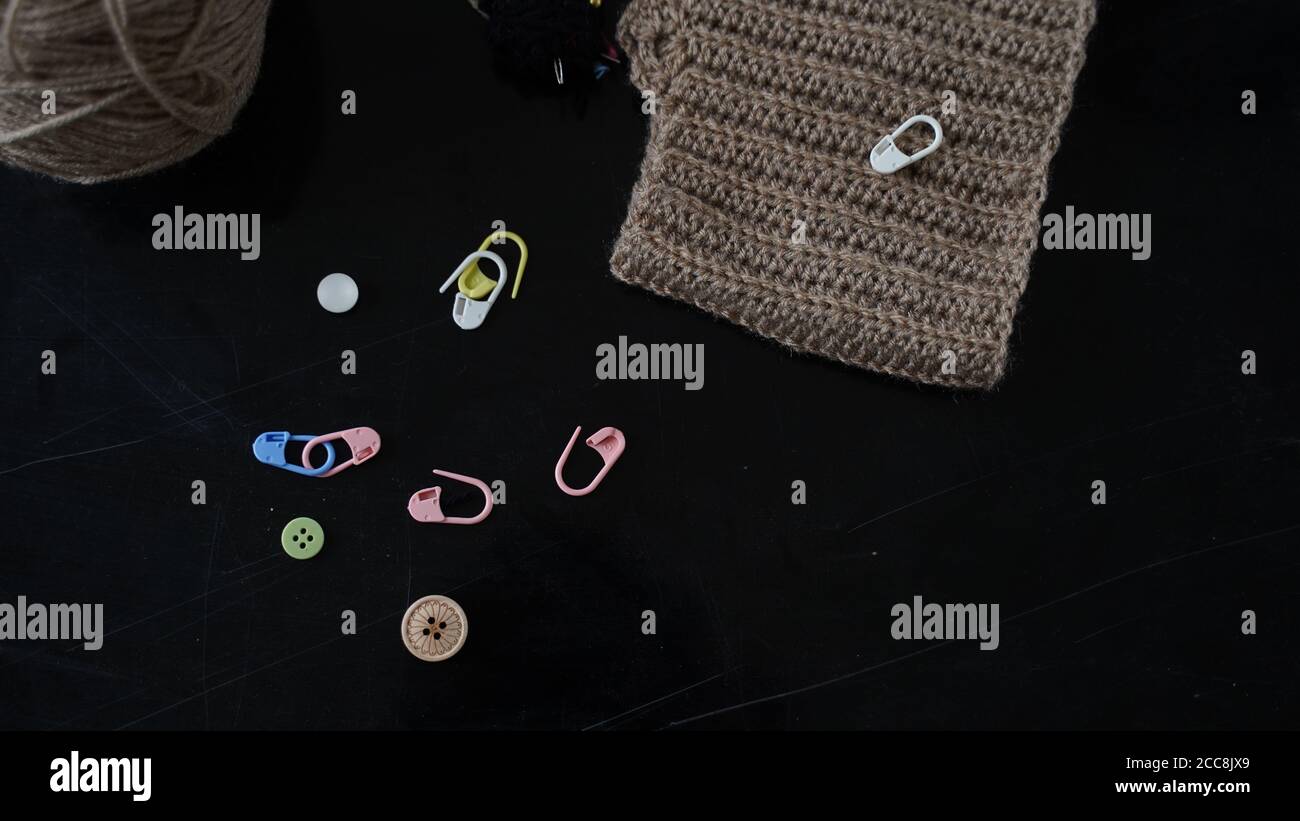 Top view of the colourful safety pins on the fabric Stock Photo - Alamy