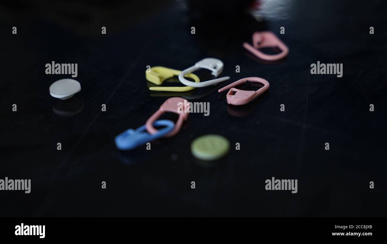 Colourful safety pins and buttons Stock Photo - Alamy