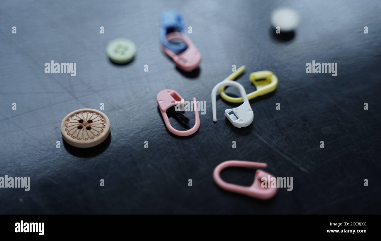 Colourful safety pins and buttons Stock Photo - Alamy