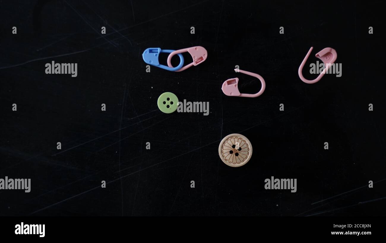 Colourful safety pins and buttons Stock Photo - Alamy