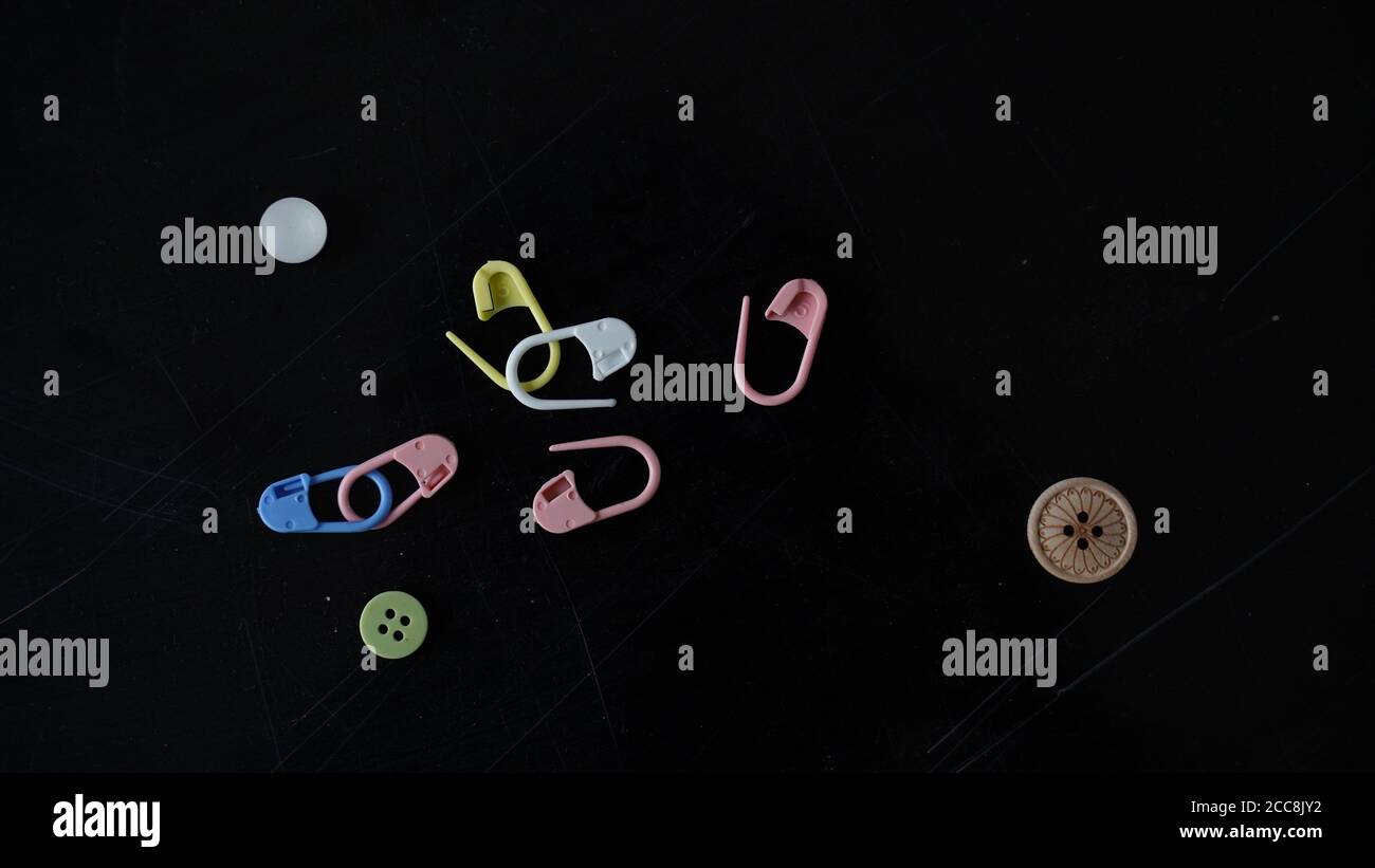 Colourful safety pins and buttons Stock Photo - Alamy