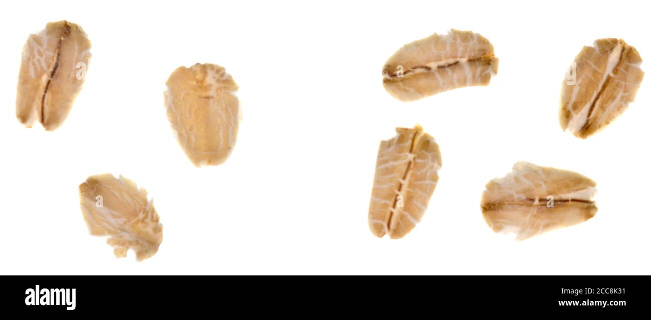 Oat flakes isolated on white background Stock Photo - Alamy