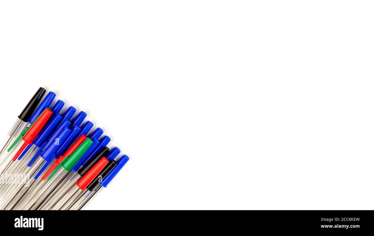 Pile of a lot multi colored plastic ballpoint pens isolated on white ...
