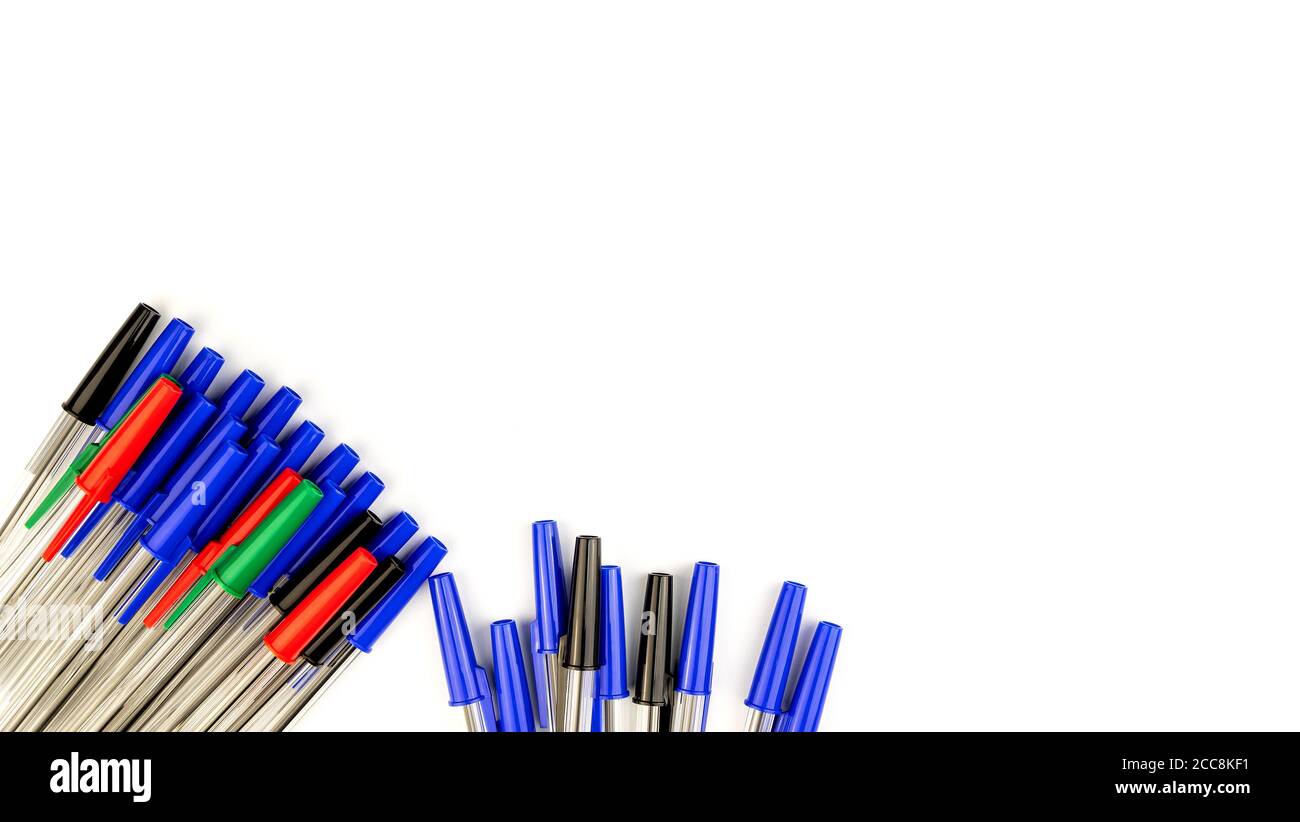 Pile of a lot multi colored plastic ballpoint pens isolated on white ...