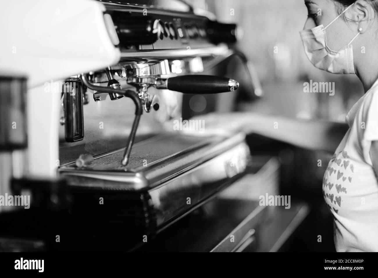 Female barista preparing and serving coffee cappuccino in a bar at ...