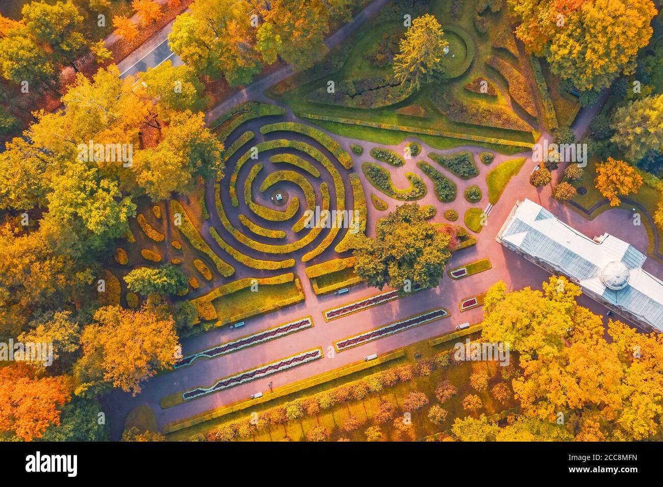 Aerial view flight over autumn valley park with trees, walking paths ...
