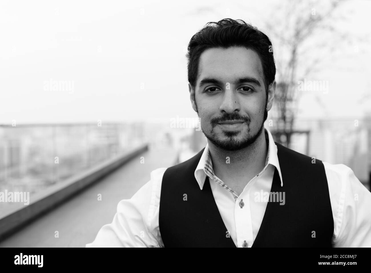 Young handsome Indian man at rooftop restaurant Stock Photo - Alamy
