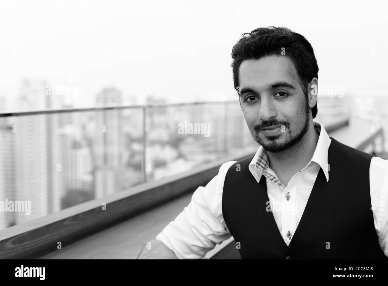 Young handsome Indian man at rooftop restaurant Stock Photo - Alamy