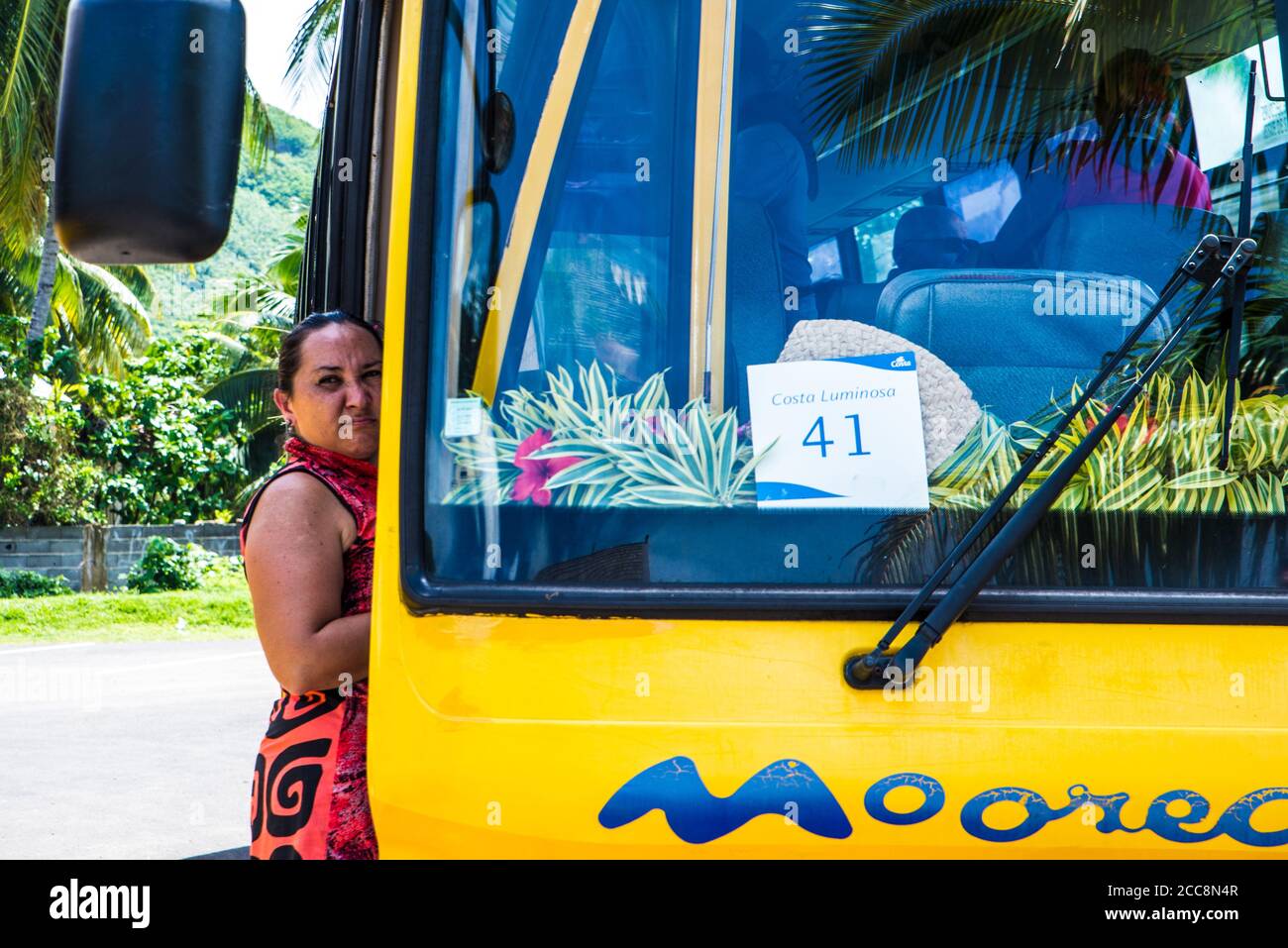 Moorea, French Polynesia: 09/03/2018: A local woman waiting next to the ...