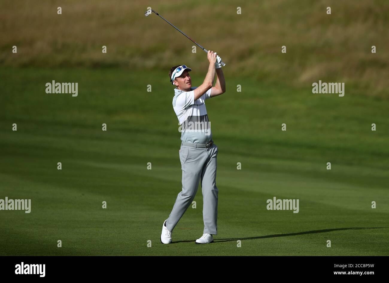 England's Steven Tiley chips on to the 2nd green during the day one of ...