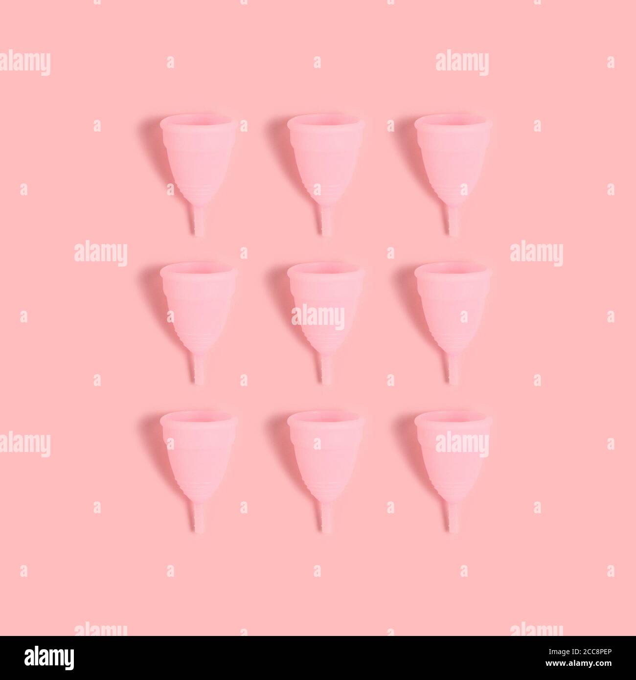 Menstrual cups layout on a pink background. Monochrome zero waste ...