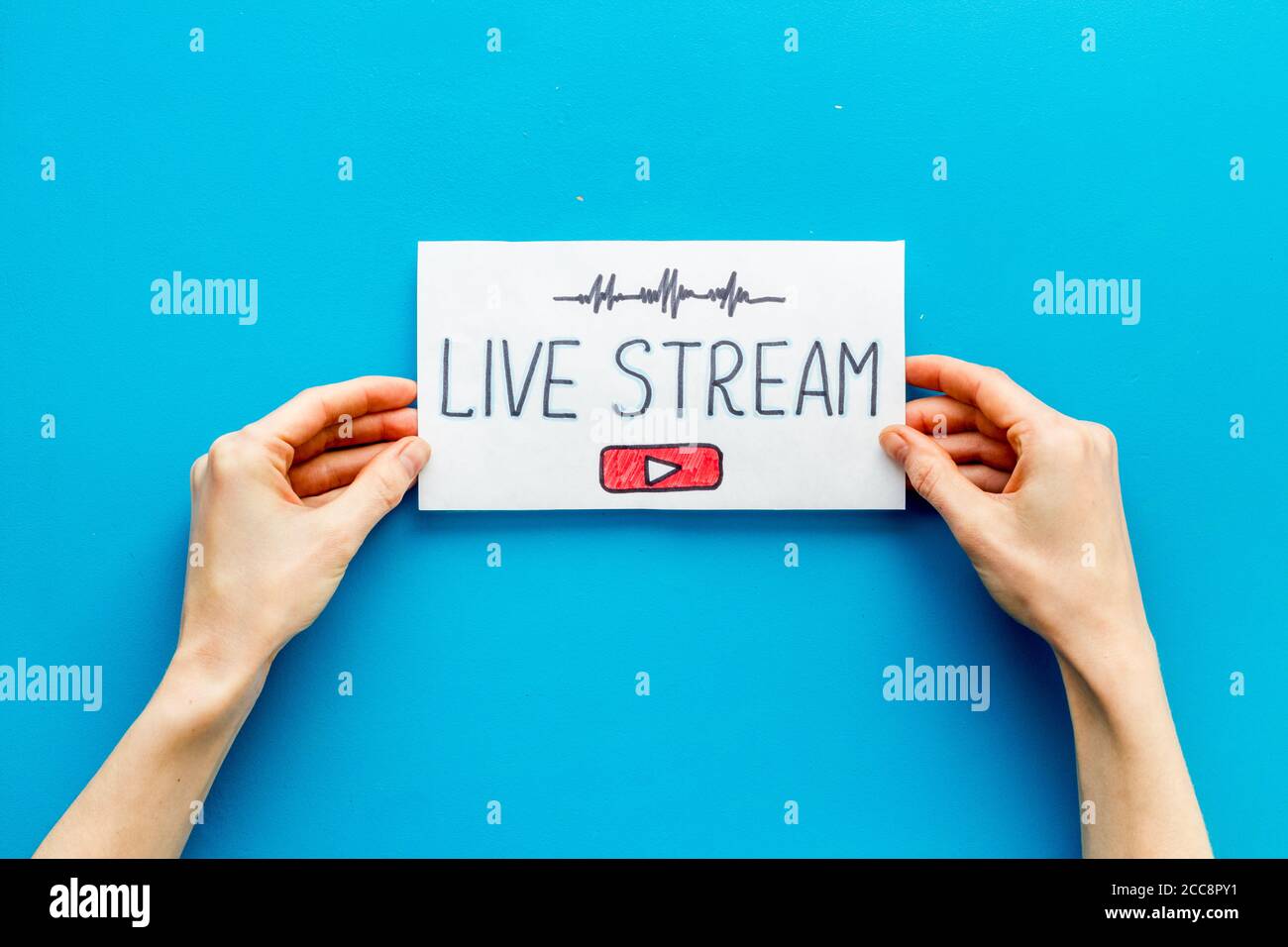 Live streaming web network concept. Female hands holding paper tablet ...