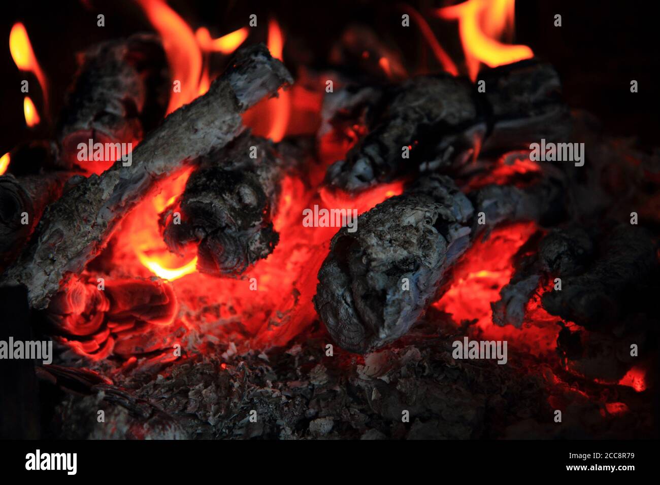 fireplace background (fire texture) in the dark Stock Photo - Alamy