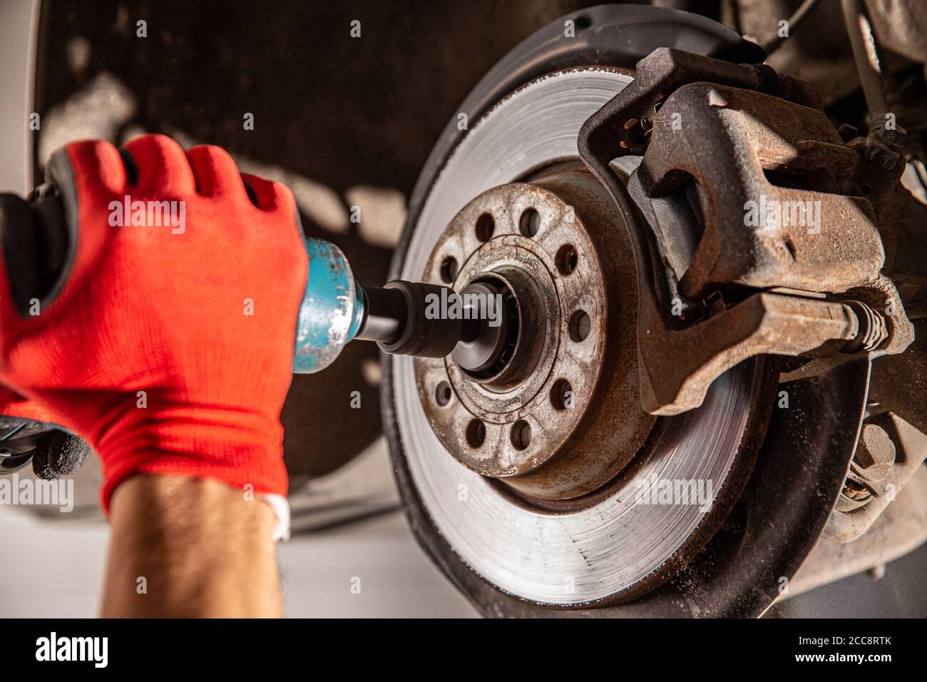 Close up hand a man change bearing of wheel in the car maintenance ...