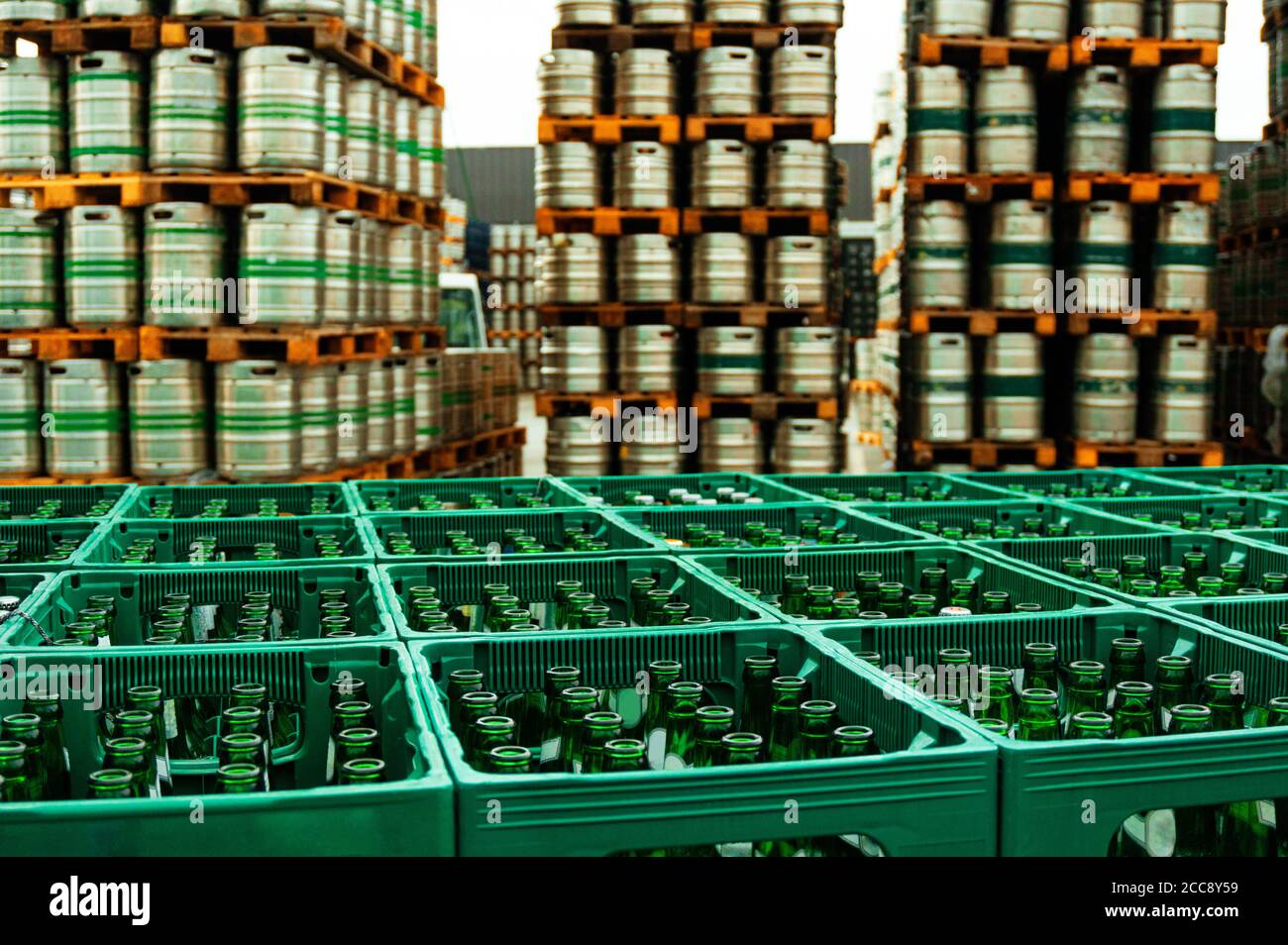 Germany Brewery. Box with bottles of beer at first plan and pallets of ...