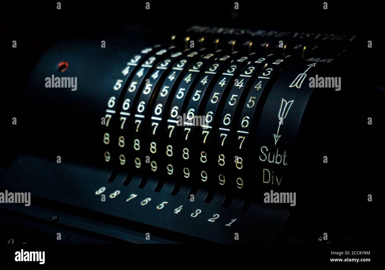 Old arithmometer with white numbers on black background Stock Photo - Alamy