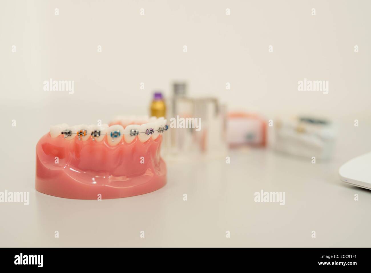 Selective focus shot of metal braces on artificial teeth Stock Photo ...