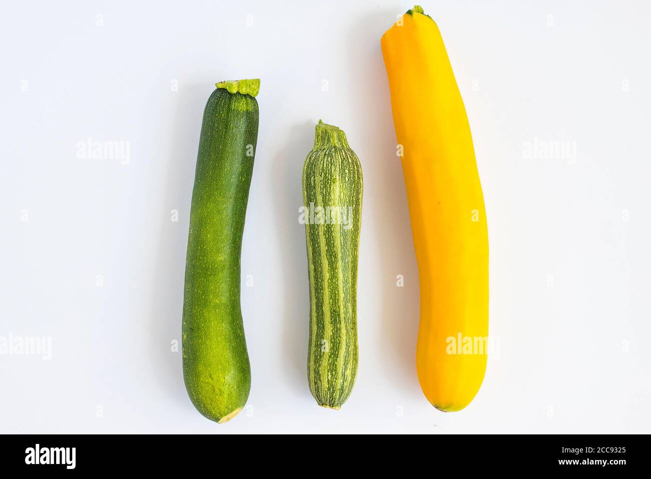Three zucchini in different variety and colors, representing a ...