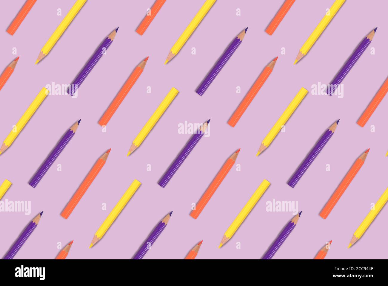 Color pencils pattern on a purple pastel background. Back to school ...