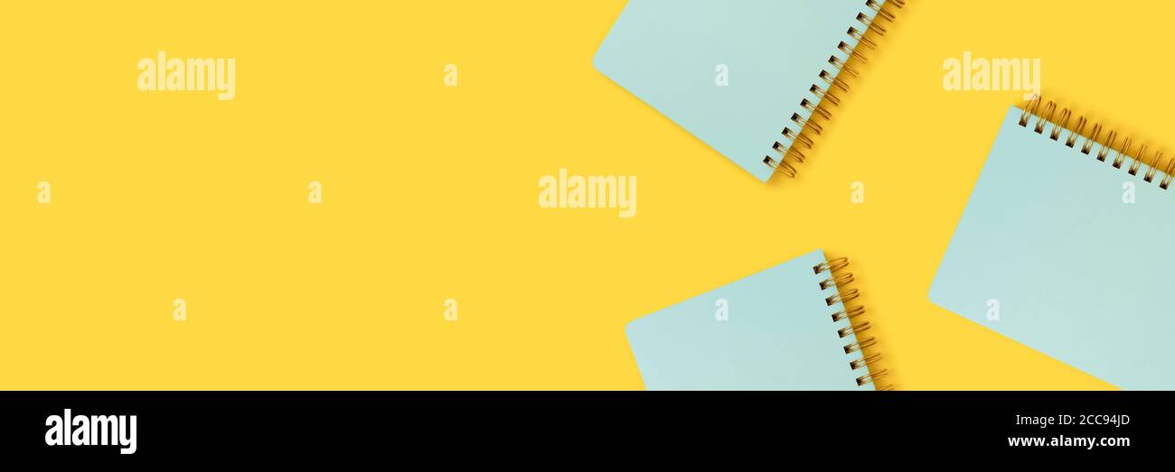 Banner with mint spiral notebooks on a yellow background. Cute school ...