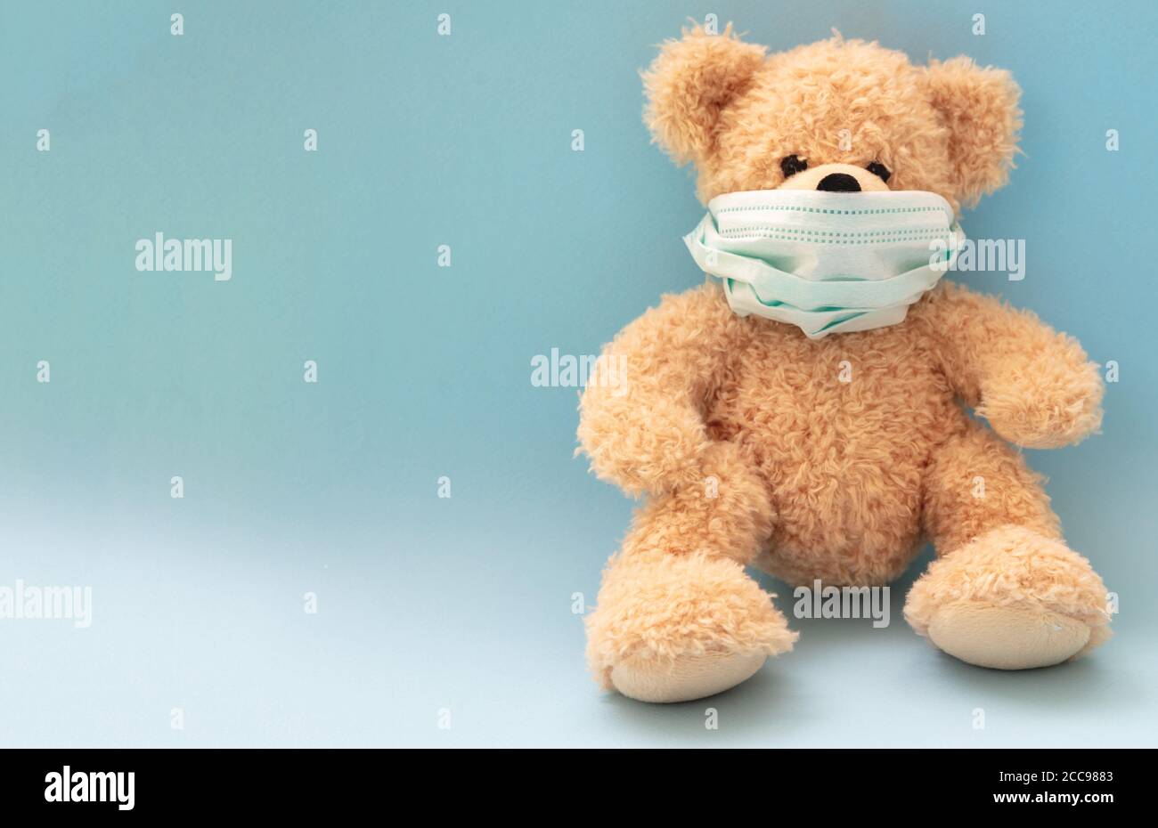 Child kid coronavirus and pollution protection concept. Τeddy bear doll ...