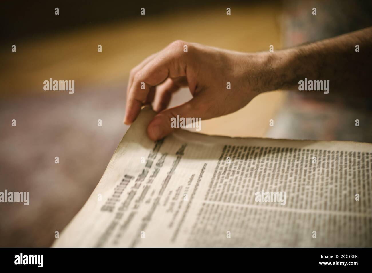 Curious man choosing book hi-res stock photography and images - Alamy