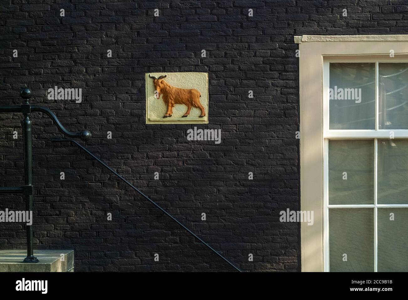 guild sign on an Amsterdam brick facade Stock Photo - Alamy