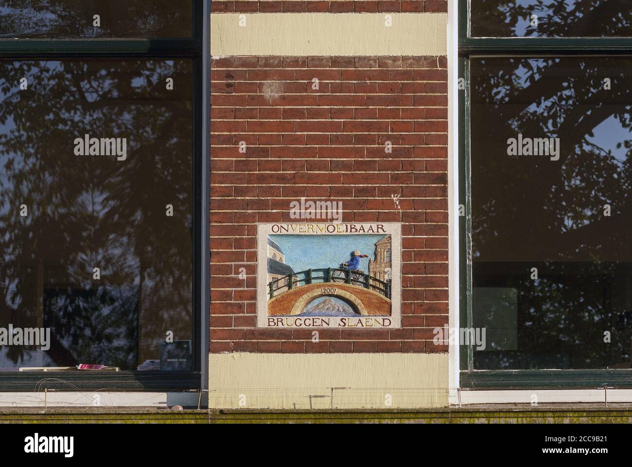 old guild sign on an brick facade in Amsterdam, Netherland Stock Photo ...