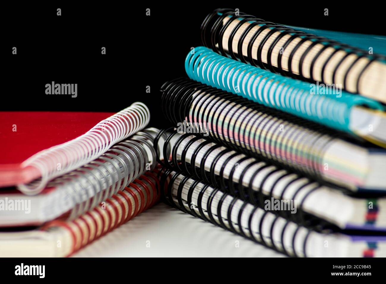 Spiral notebook pile hi-res stock photography and images - Alamy