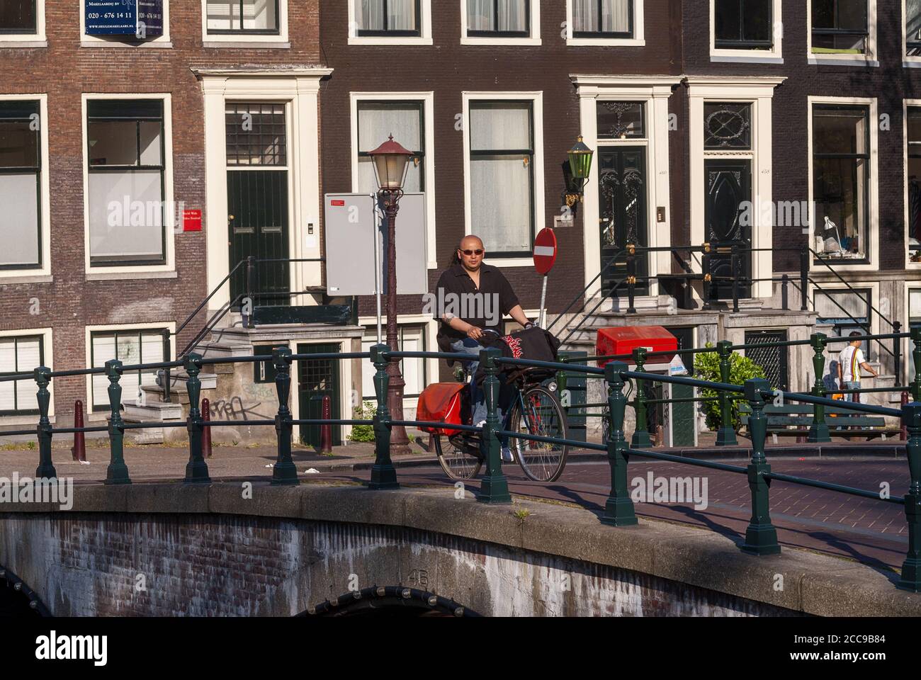 Traditional historic Dutch gable houses beside canal in Amsterdam The ...