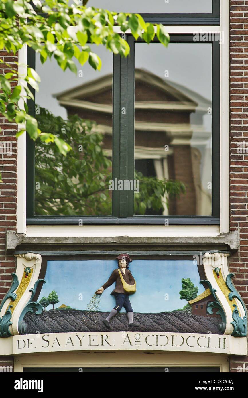 guild sign on an Amsterdam brick facade Stock Photo - Alamy