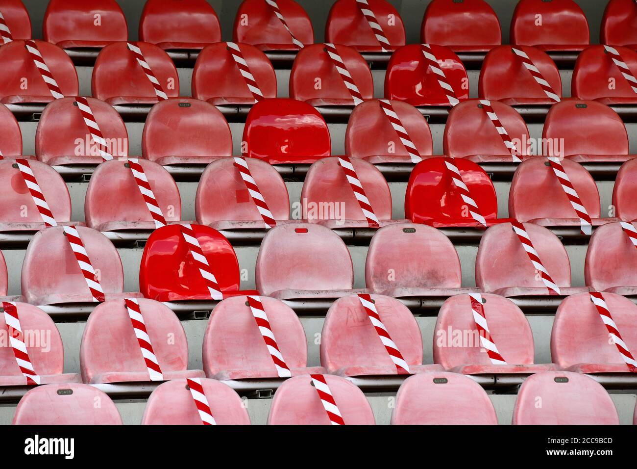 Partially faded red seats in the Franz Kremer Stadium. Prepared with ...