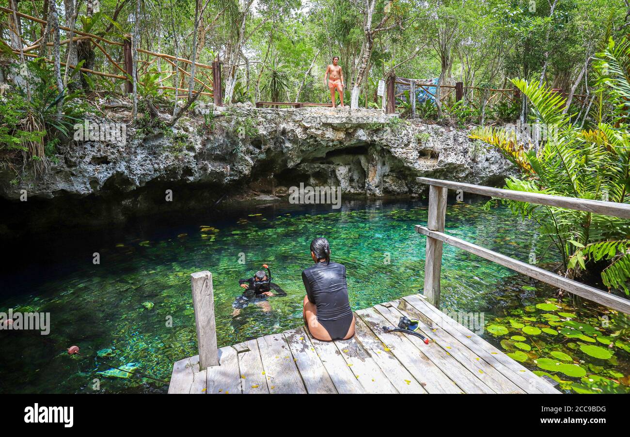 TULUM, QUINTANA ROO, MEXICO - Jul 28, 2019: Visitors enjoy swimming in ...