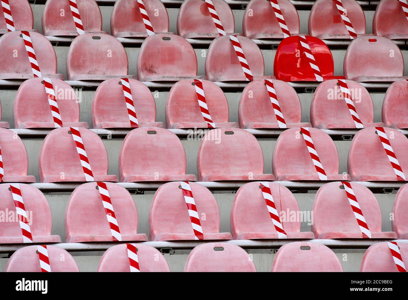 Partially faded red seats in the Franz Kremer Stadium. Prepared with ...