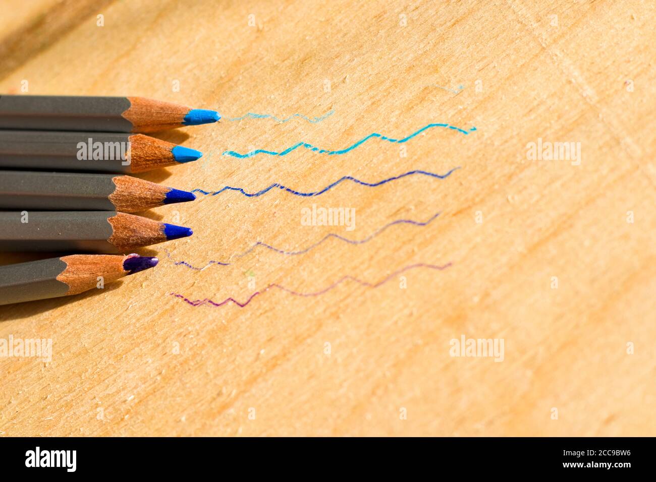 Pencil colors painting instruments on the table, pencil sets. Blue ...