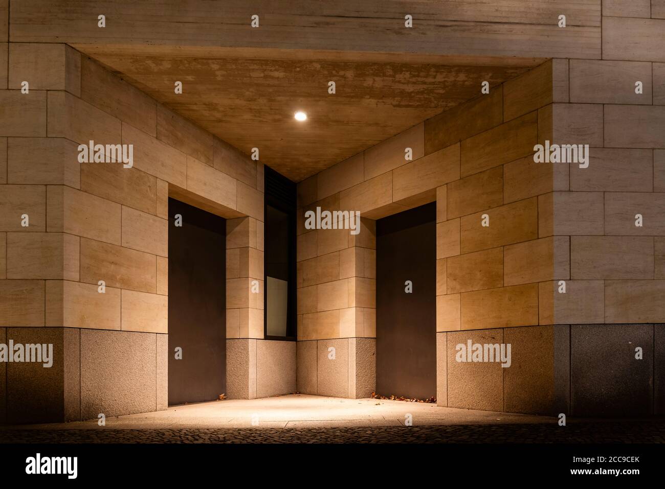 Two doors and a lamp in a triangular niche, two doors and sandstone ...