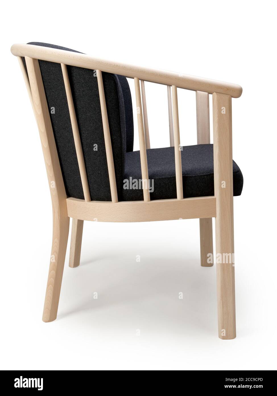 Side view of wooden chair with black textile seat Stock Photo - Alamy