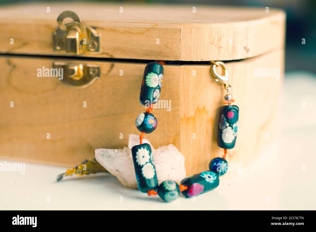 Wooden box, mineral stone and bijou, colorful photo Stock Photo - Alamy