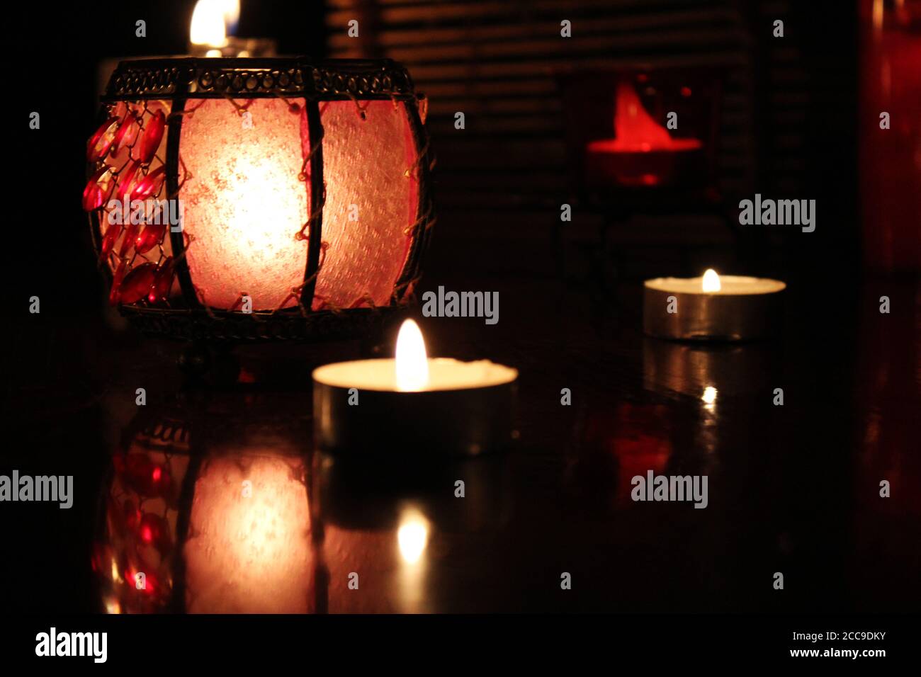 Red candle lights on the dark background, romantic scenery Stock Photo ...